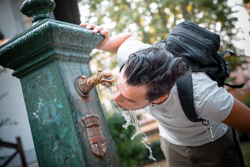Stylish Man Refreshing at the Fountain Stock Photo - Image of ...
