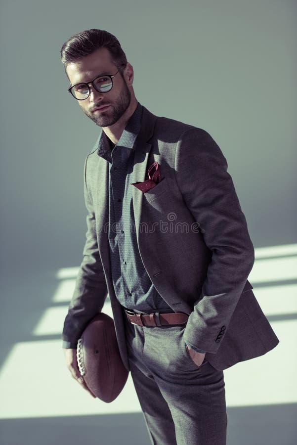 Stylish Man with Rugby Ball Stock Photo - Image of formalwear ...