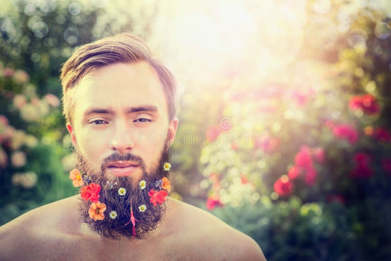 Stylish Man S Face with a Beard with Flowers in His Beard on Natural ...