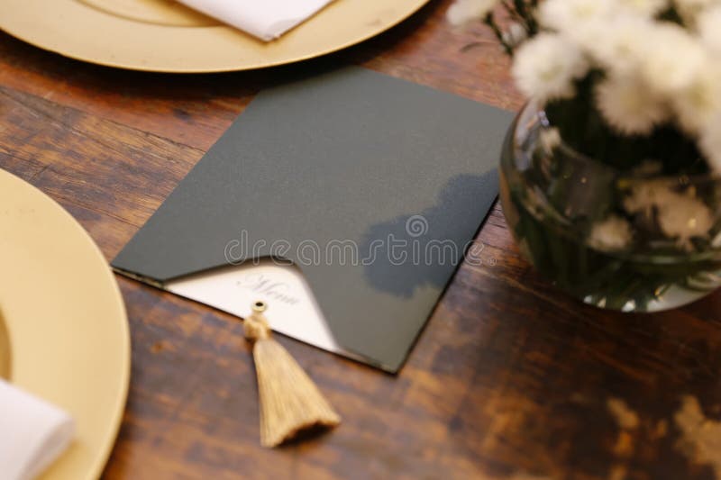 Stylish Menu in Dark Envelope on Wooden Table Stock Photo - Image of ...