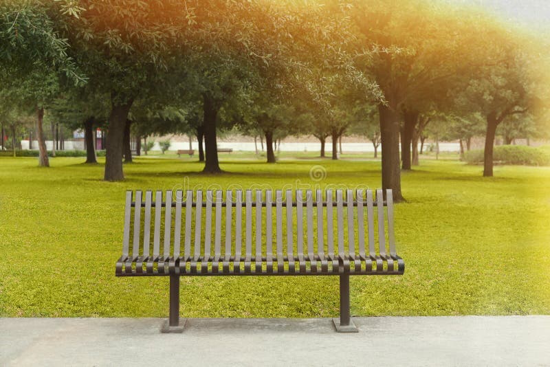 Stylish Metal Bench in Park on Sunny Day Stock Image - Image of ...