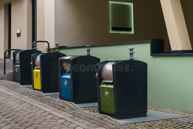 Stylish Metal Trash Containers Near the Building Stock Photo - Image of ...