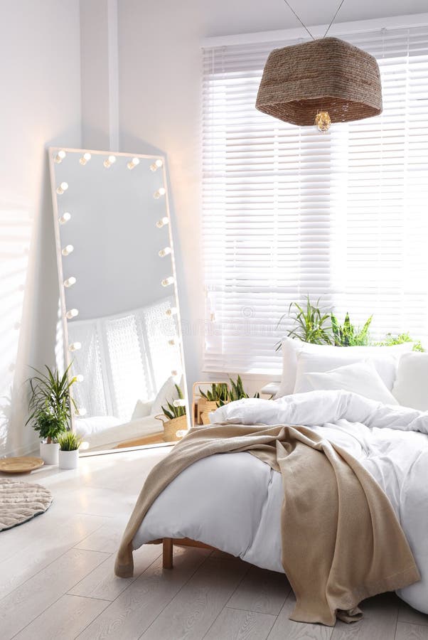 Stylish Mirror with Light Bulbs in Bedroom. Interior Design Stock Photo ...