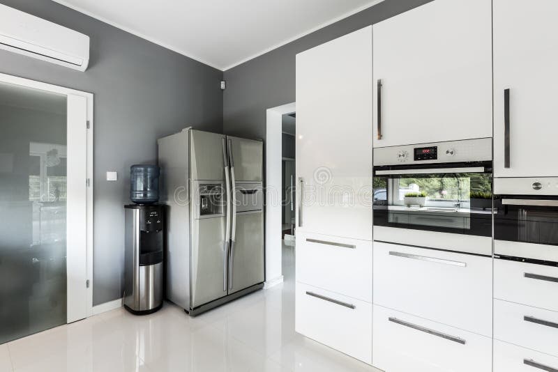 Stylish Open Plan Kitchen with Silver Fridge Stock Image - Image of ...
