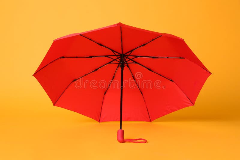 Stylish Open Red Umbrella on Yellow Background Stock Photo - Image of ...