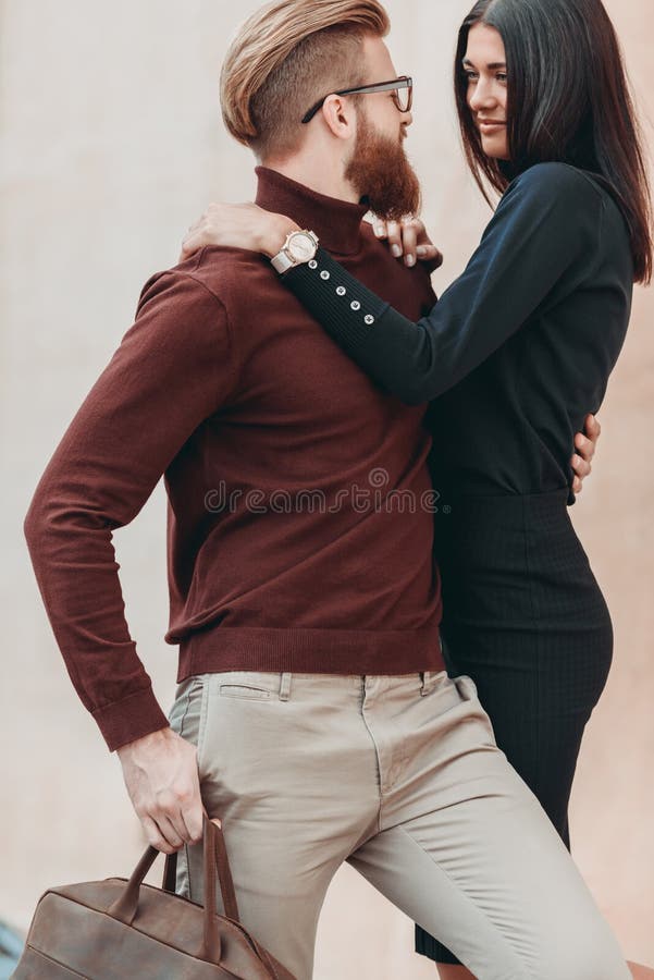 Stylish Passionate Couple Embracing and Looking Stock Image - Image of ...