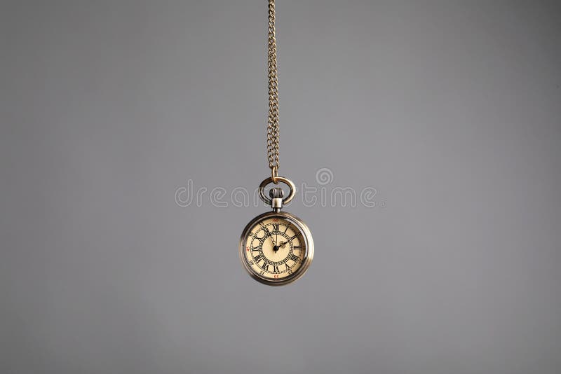 Stylish Pendulum on Grey Background. Hypnotherapy Session Stock Image ...