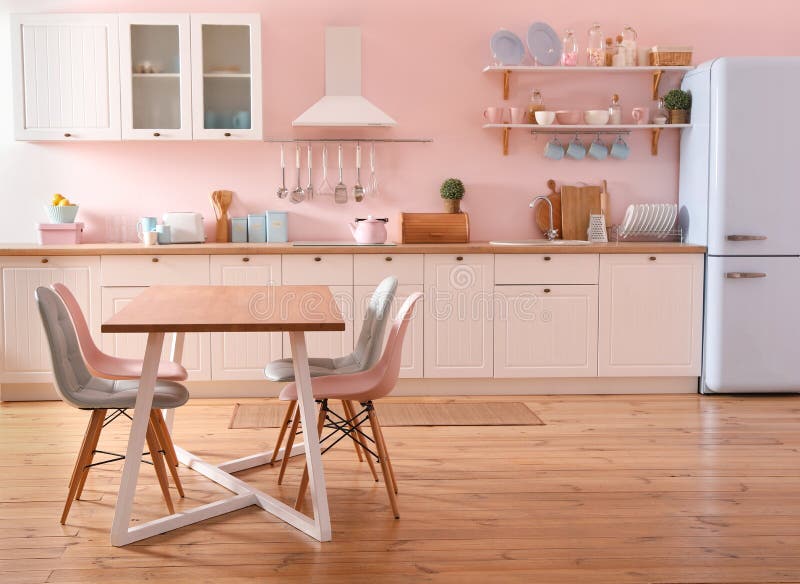 Stylish Pink Kitchen Interior with Table and Chairs Stock Photo - Image ...