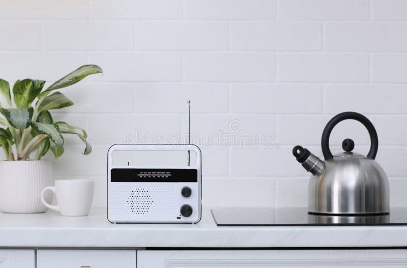 Stylish Radio on Kitchen Counter Near White Brick Wall Stock Photo ...