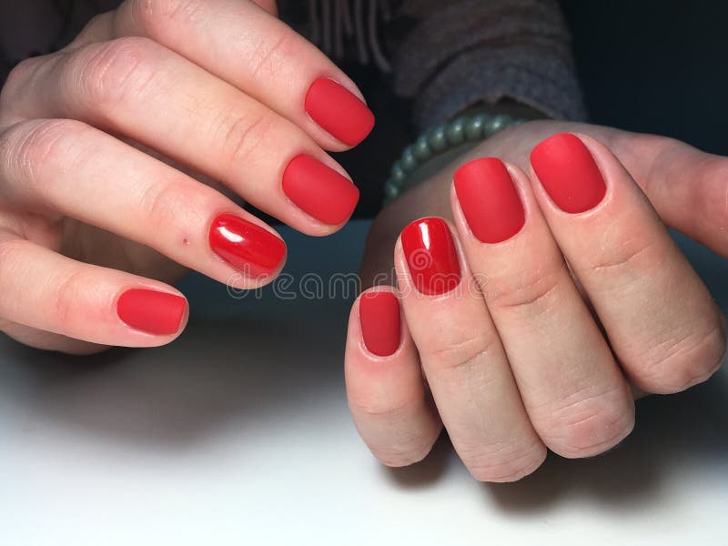 Stylish Red Manicure with a Matte Effect Design on Short Nails Stock ...