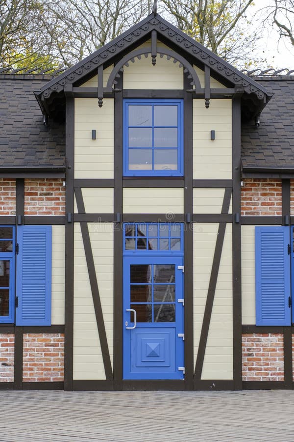 Stylish Retro Facade Building with Brick and Wood Trim. Stock Photo ...