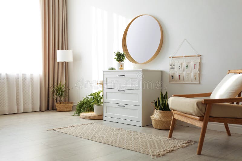 Stylish Room Interior with Chest of Drawers and Mirror Stock Photo ...