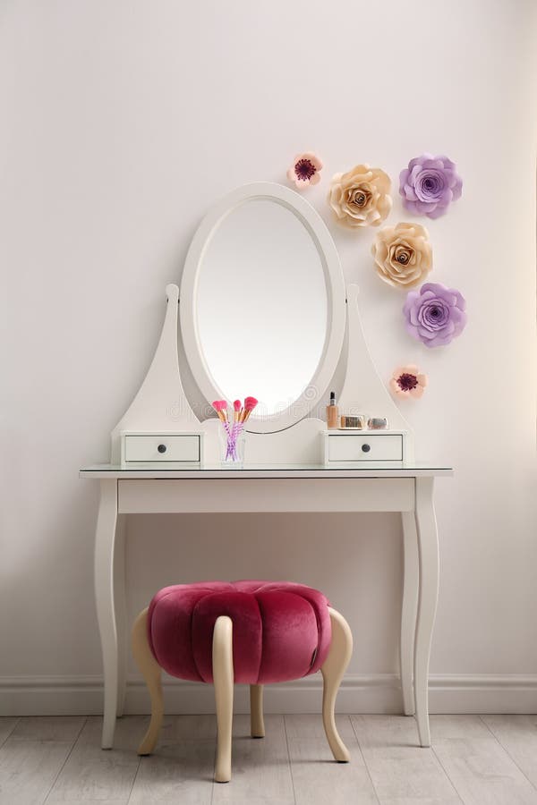 Stylish Interior with Floral Decor, Dressing Table and Pouf Stock Photo ...