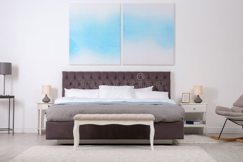 Stylish Room Interior with Large Comfortable Bed Stock Image - Image of ...