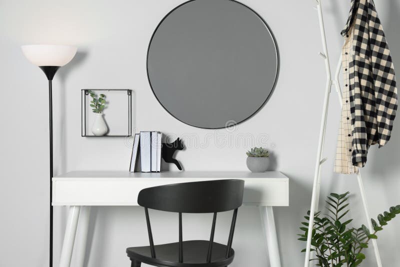 Stylish Room Interior with Round Mirror on White Wall Over Desk Stock ...