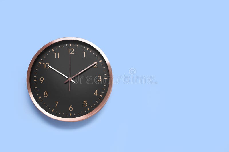 Stylish Round Clock on Light Blue Background, Top View with Space for ...