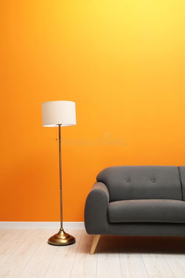 Stylish Sofa and Floor Lamp in Room. Interior Design Stock Image ...