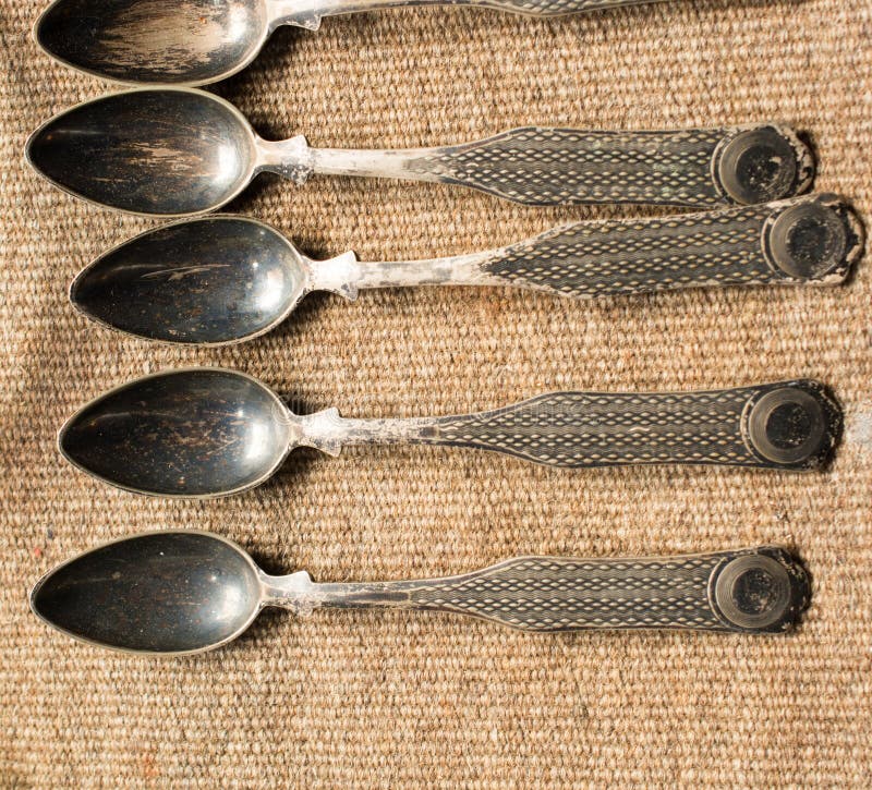 Stylish Steel Teaspoons on a Textured Background Stock Image - Image of ...