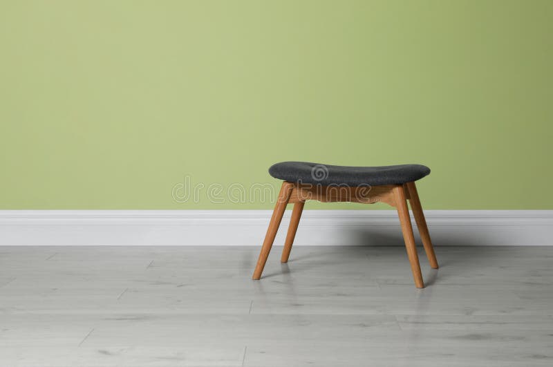 Stylish Stool Near Light Green Wall Indoors. Space for Text Stock Image ...