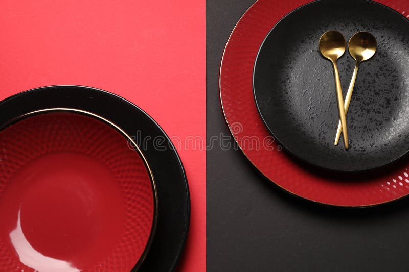 Stylish Table Setting with Plates and Spoons on Color Background, Top ...