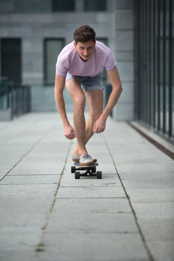 Stylish Teenager Riding a Longboard Stock Photo - Image of longboarding ...