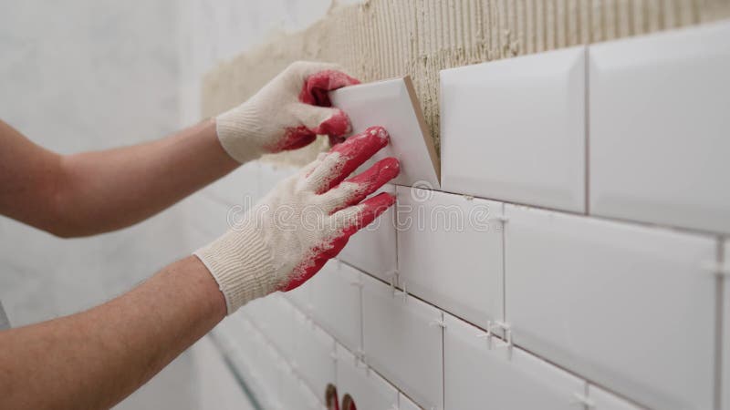 Tiler Hands in the Process of Laying White Rectangular Tiles on ...