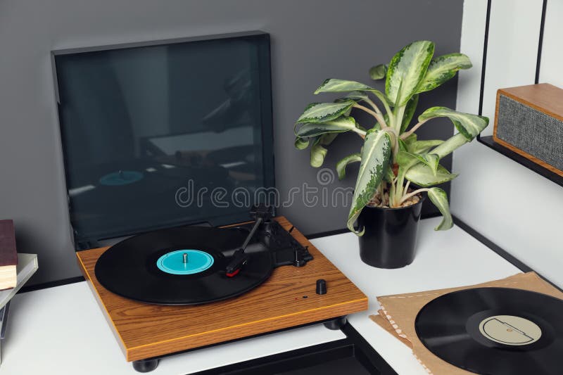 Stylish Turntable with Vinyl Disc Near Grey Wall in Room Stock Image ...