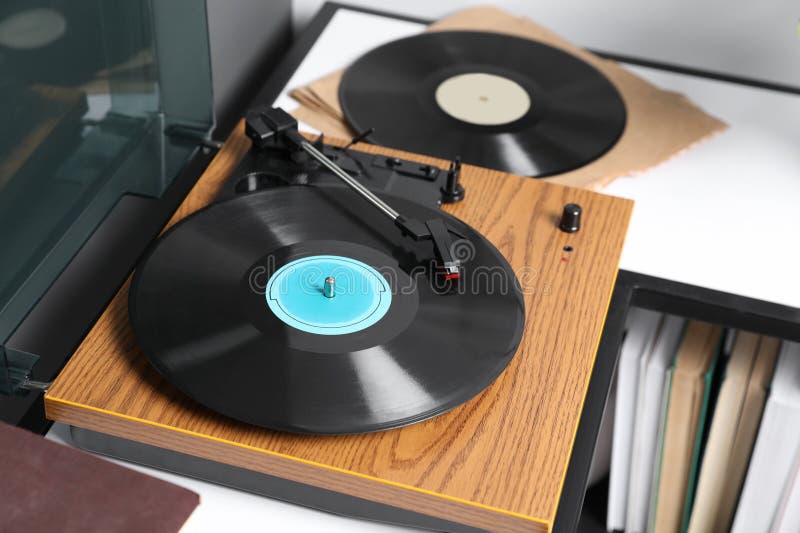 Stylish Turntable with Vinyl Disc on Table in Room, Closeup Stock Photo ...