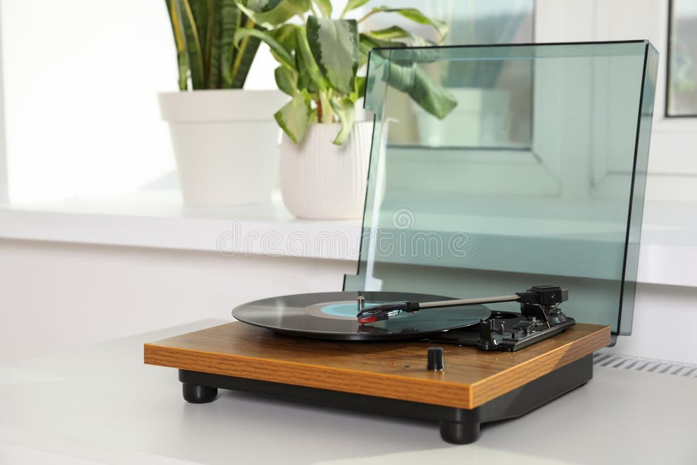 Stylish Turntable with Vinyl Disc on White Table at Home, Space for ...