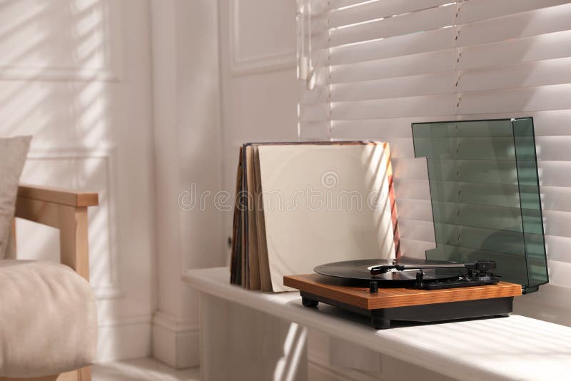 Stylish Turntable with Vinyl Discs on Windowsill in Room. Space for ...