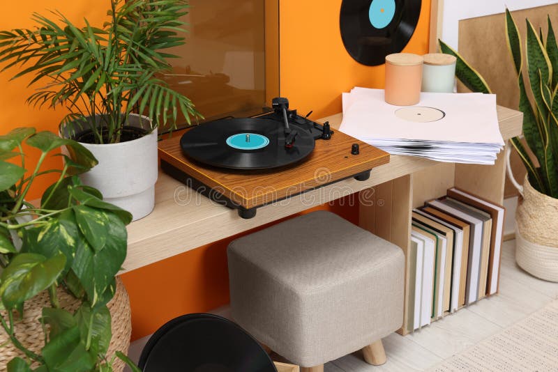 Stylish Turntable with Vinyl Record on Console Table in Cozy Room Stock ...