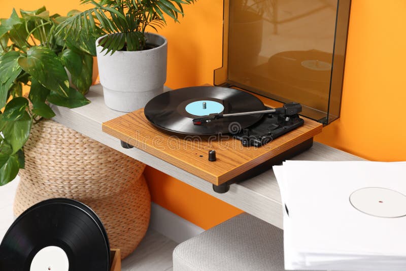 Stylish Turntable with Vinyl Record on Console Table Indoors Stock ...