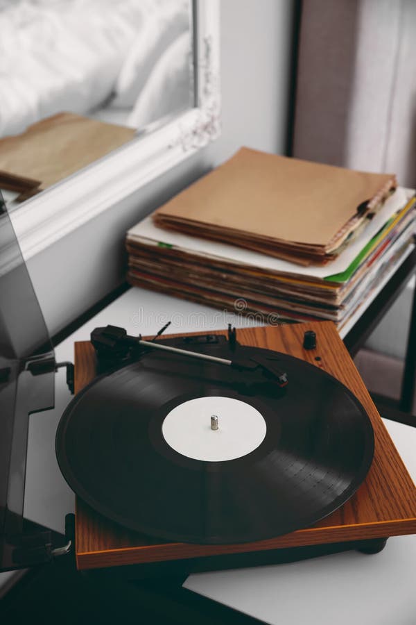 Stylish Turntable with Vinyl Record on Table Indoors Stock Image ...