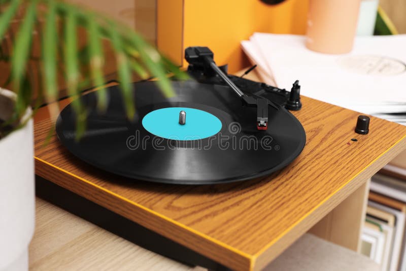 Stylish Turntable with Vinyl Record on Table Indoors Stock Image ...