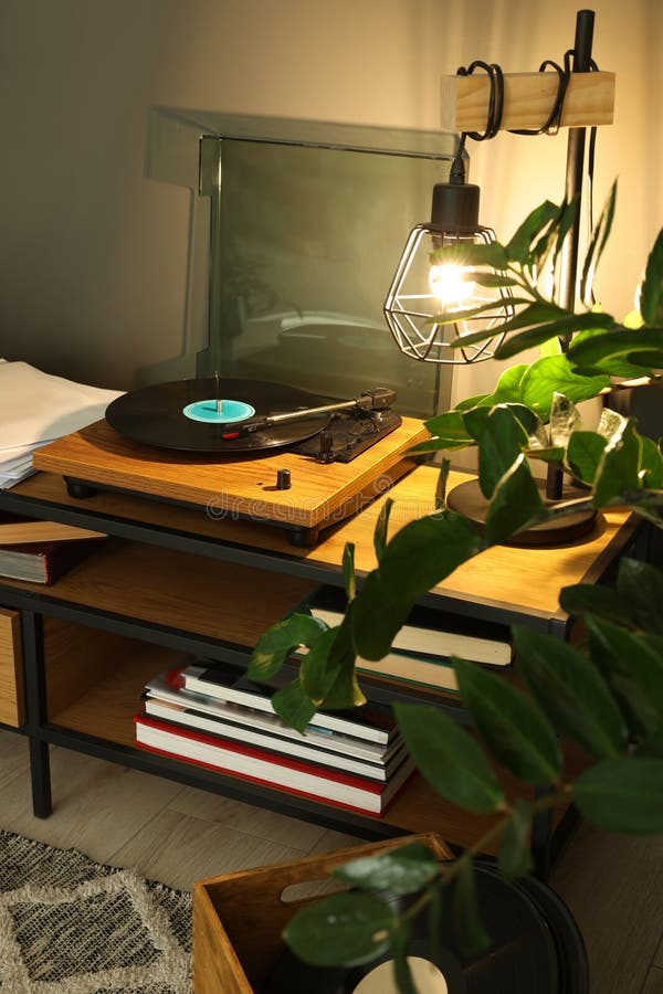 Stylish Turntable with Vinyl Record on Tv Table in Cozy Room Stock ...