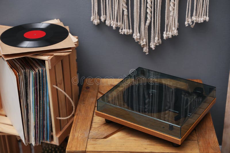 Stylish Turntable on Wooden Crate in Room Stock Photo - Image of design ...