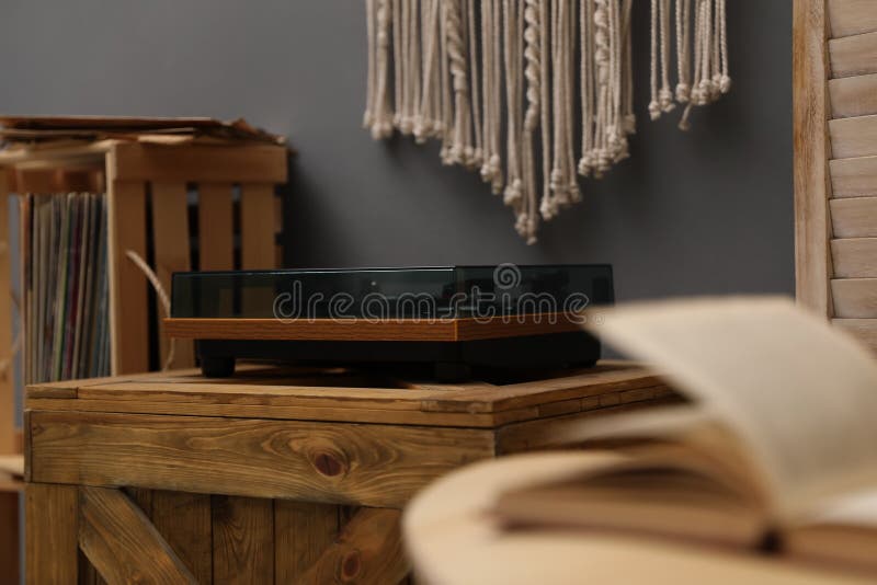 Stylish Turntable on Wooden Crate in Room Stock Photo - Image of ...