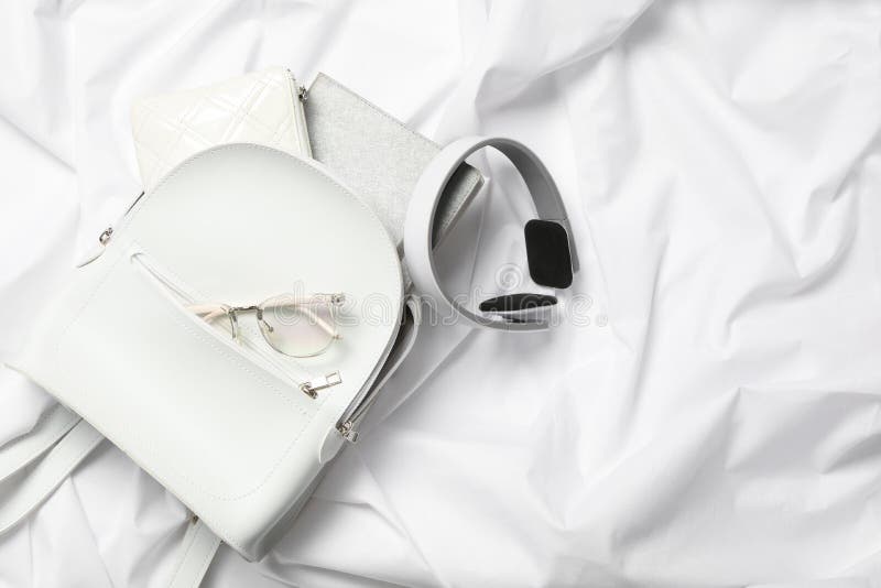 Stylish Urban Backpack with Different Items on White Fabric, Flat Lay ...