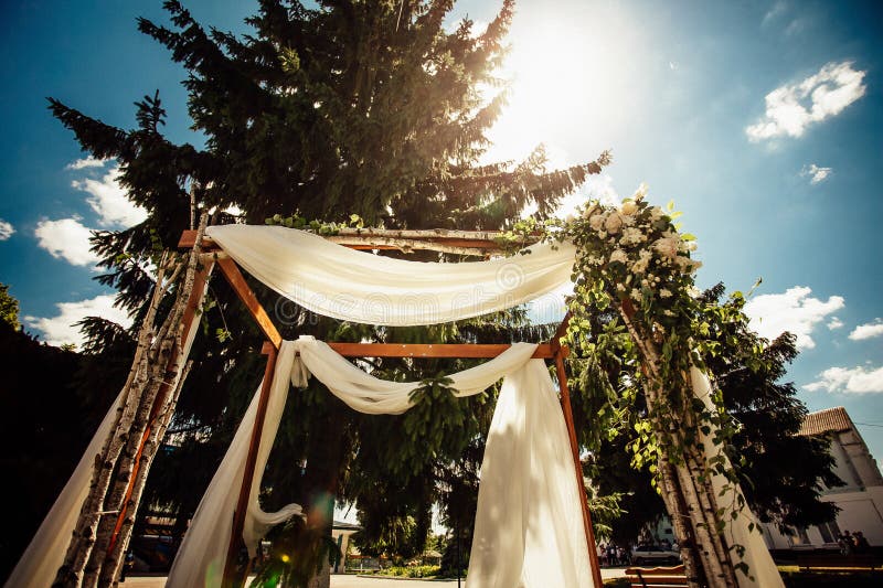 Stylish Wedding Arch with Fresh Flowers for the Ceremony. Creative ...