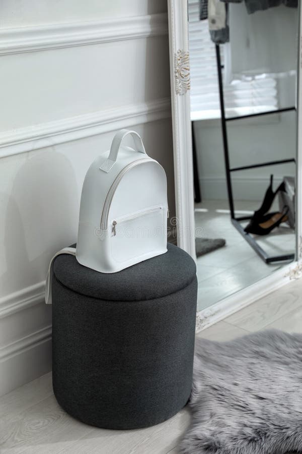 Stylish White Backpack on Pouf in Dressing Room Stock Image - Image of ...