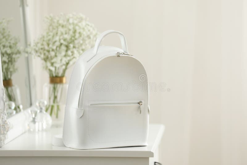 Stylish White Backpack on Table Indoors, Space for Text Stock Photo ...