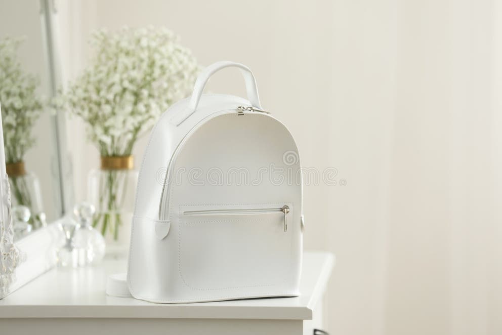 Stylish White Backpack on Table Indoors, Space for Text Stock Photo ...