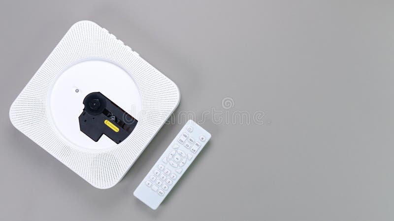 Stylish White Portable Compact CD Player with Controller on Grey ...