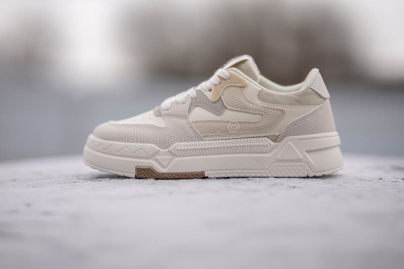 Stylish White Sneaker Standing on Concrete Surface in Lateral View ...