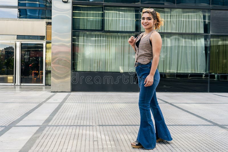Young Woman Walking Confidently in Urban Setting Stock Image - Image of ...