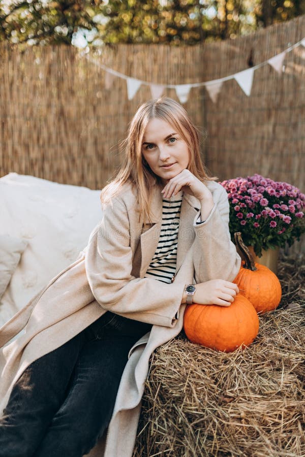 Stylish Blond Woman Wearing Coat In Nature Background Elegance At Fall