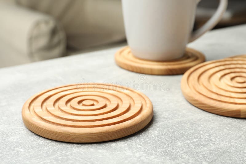 Stylish Wooden Cup Coasters on Light Grey Table Stock Photo - Image of ...