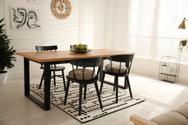 Stylish Wooden Dining Table and Chairs in Room. Interior Design Stock ...