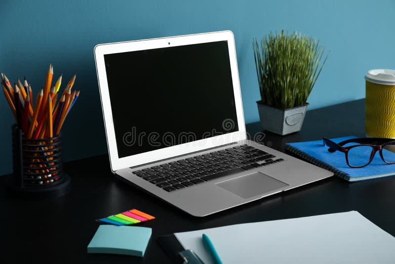 Stylish Workplace with Modern Laptop Near Color Wall Stock Image ...