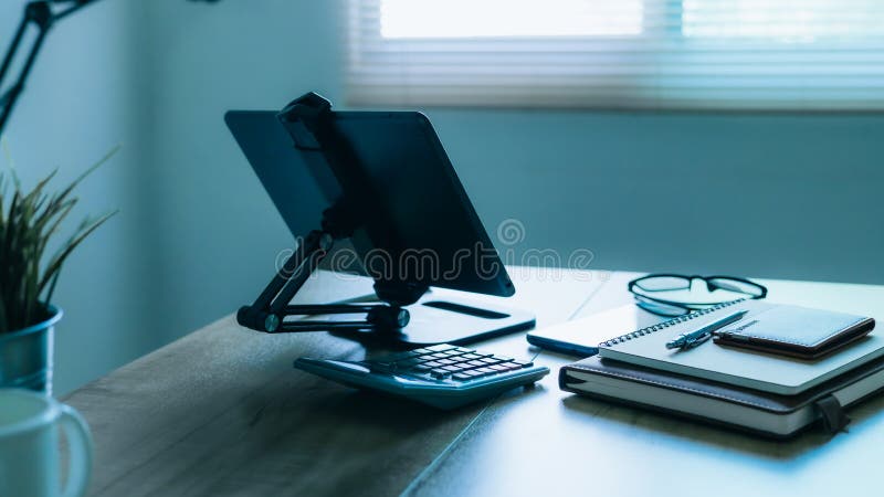 Stylish Workplace with Telephone and Tablet PC on Table in Home Office ...